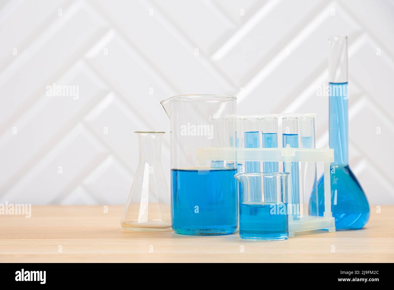 Laboratory glassware with test tubes. flasks, dropper, petri dishes ...