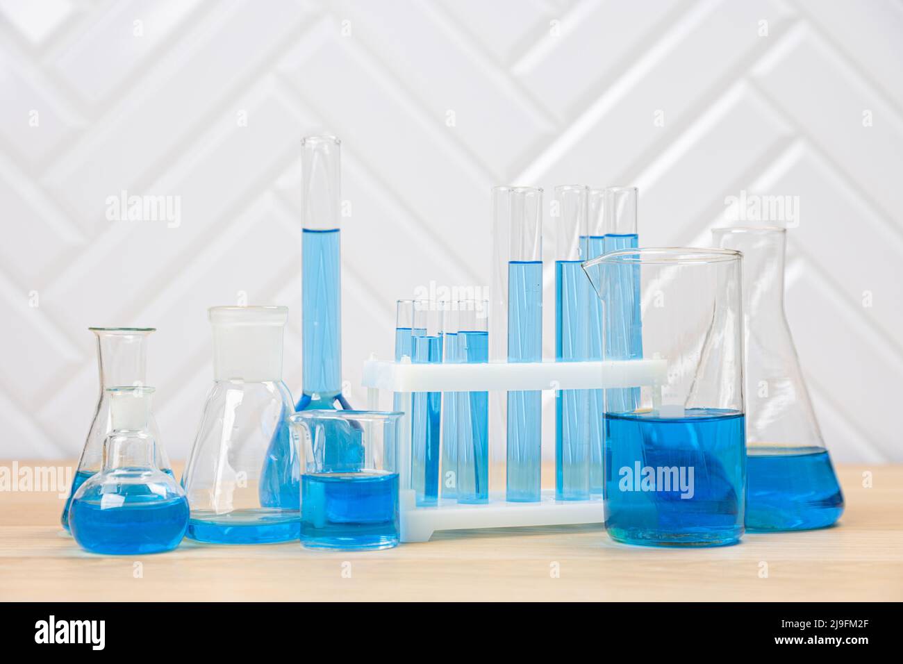 Laboratory glassware with test tubes. flasks, dropper, petri dishes ...