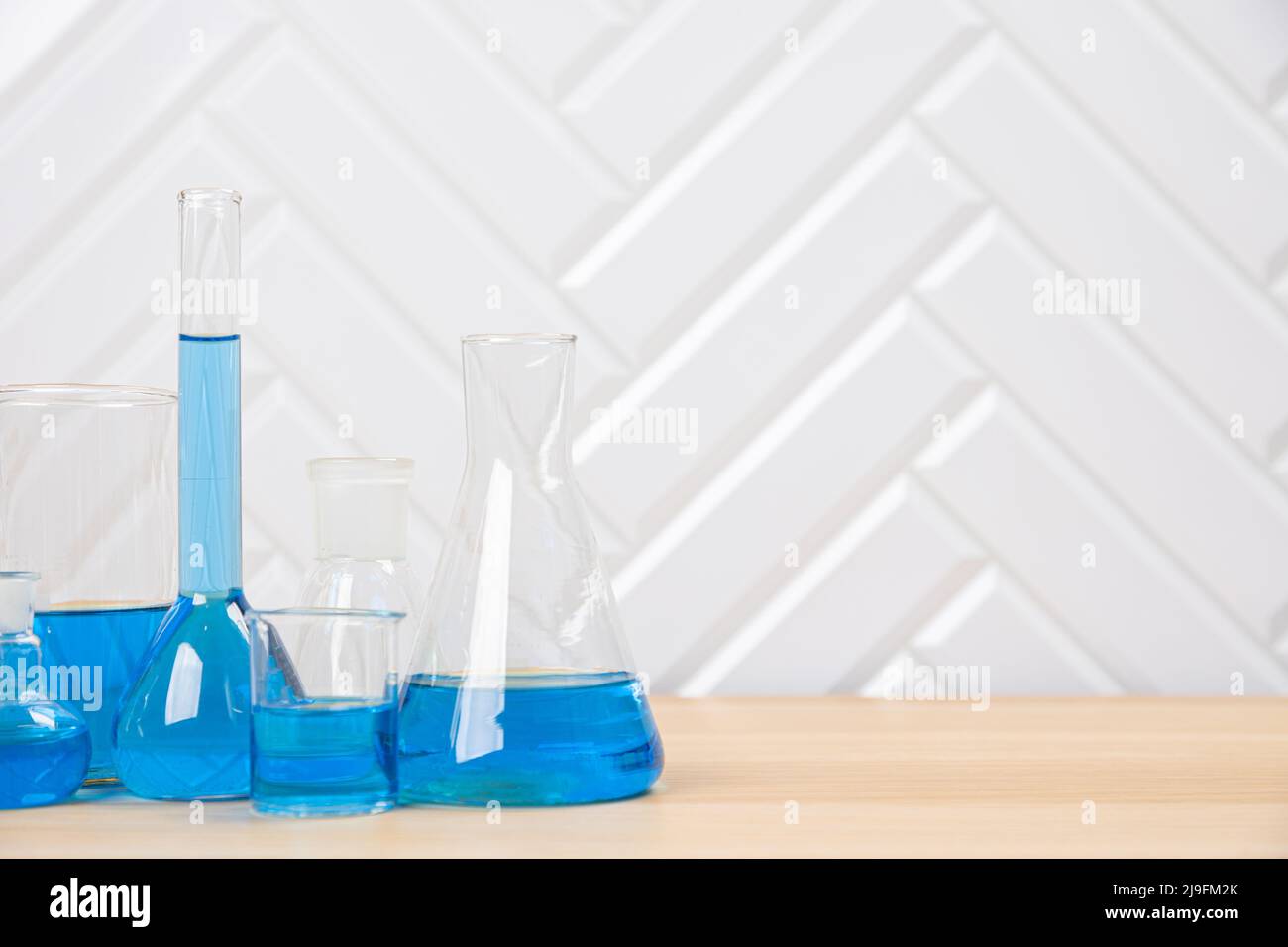 Laboratory glassware with test tubes. flasks, dropper, petri dishes ...