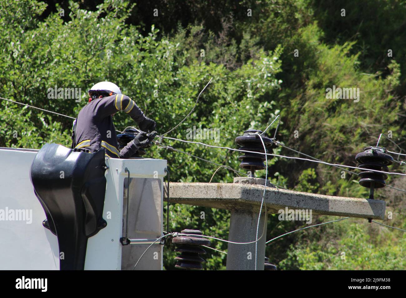 Electrician work maintenance repair cable in village Stock Photo - Alamy