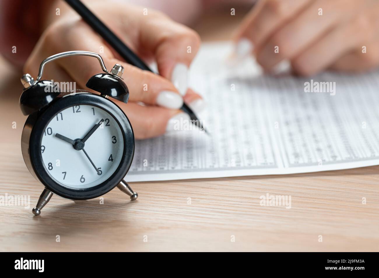 alarm clock for a student writing exams, taking an exam room with a ...