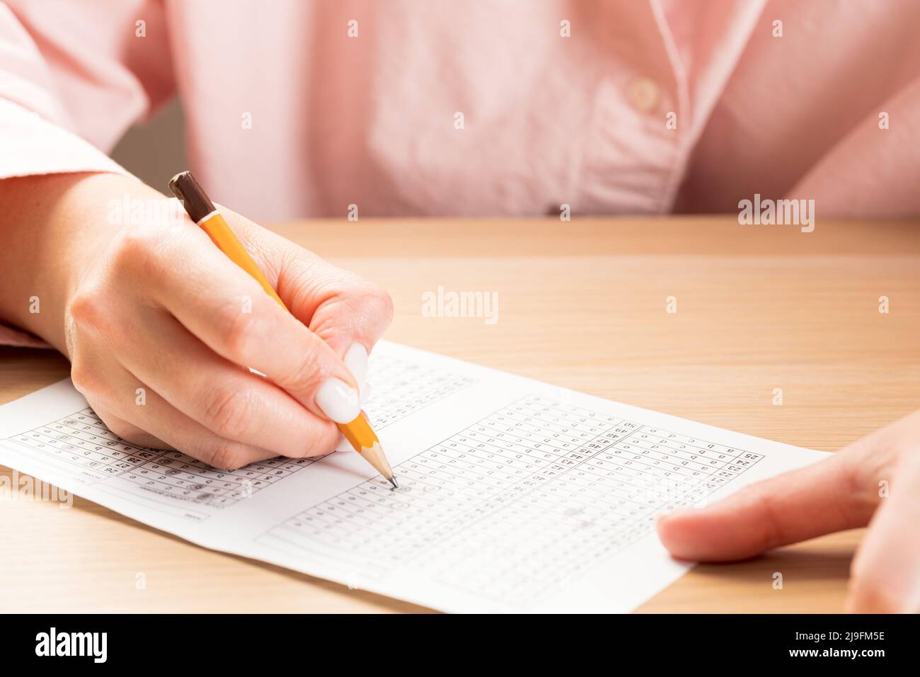 Students hands to take exams, writing an exam room with a pencil ...