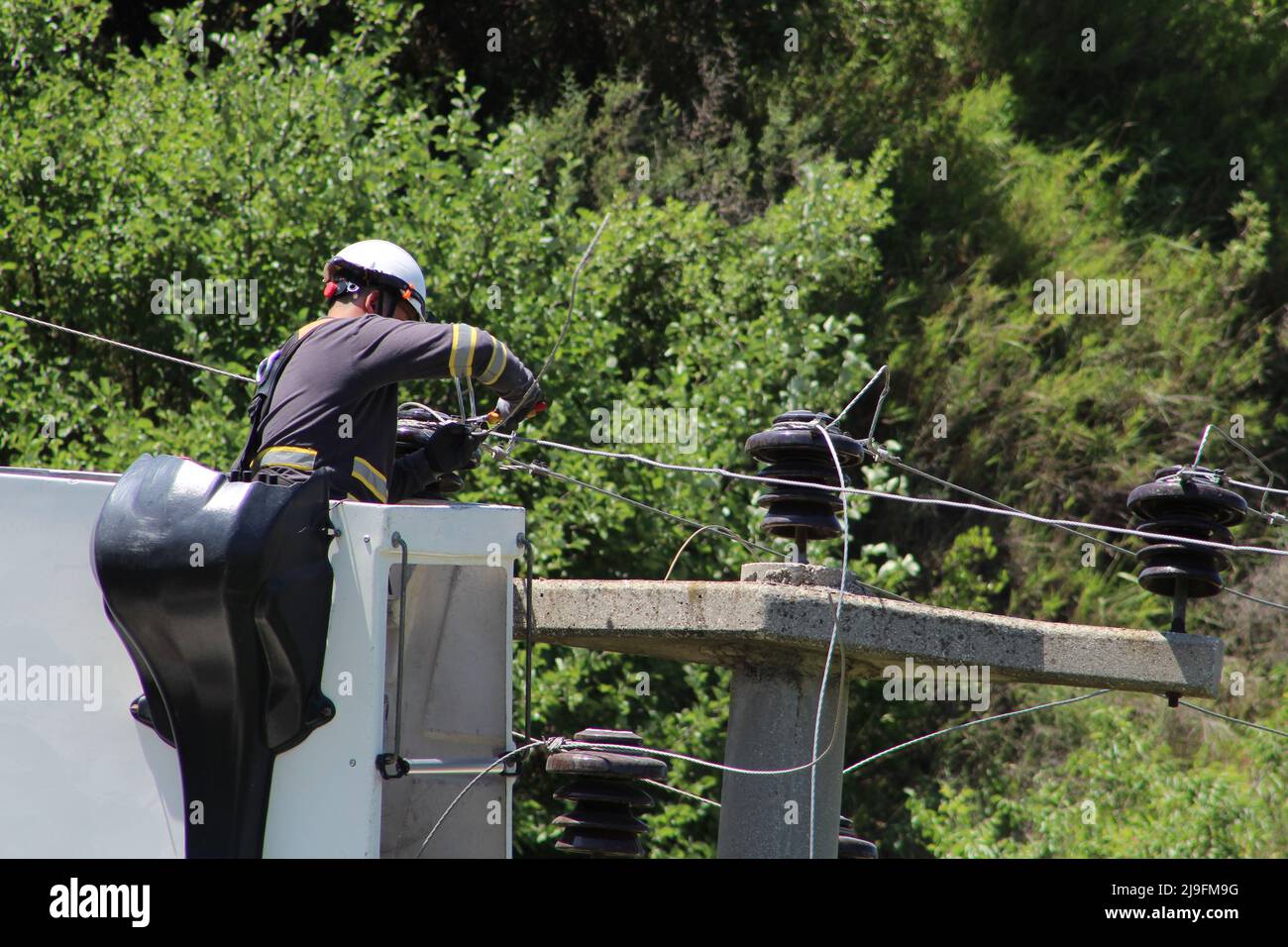Electrician work maintenance repair cable in village Stock Photo - Alamy