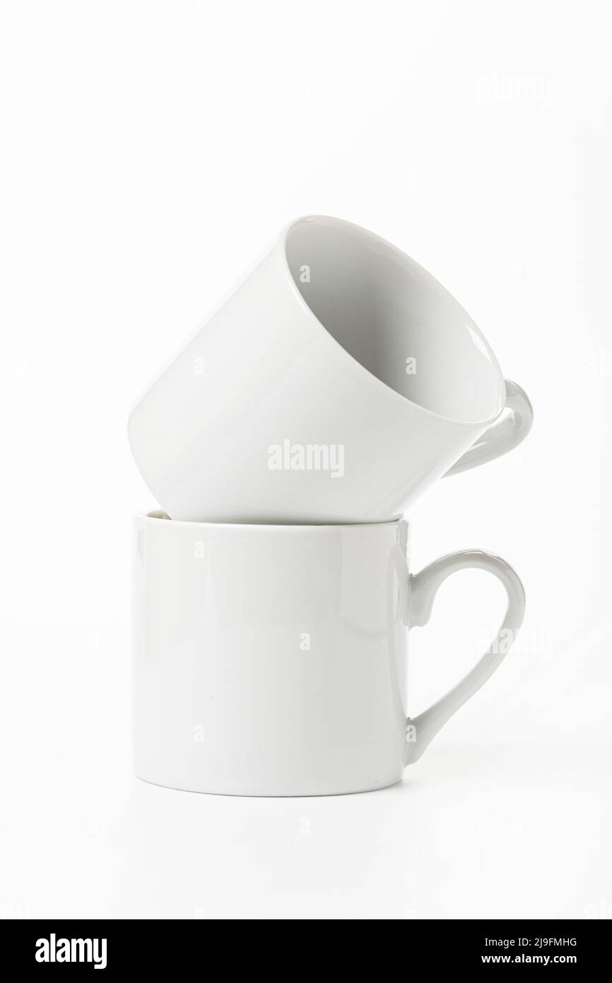 Perfect small white coffee cup on white background Stock Photo - Alamy