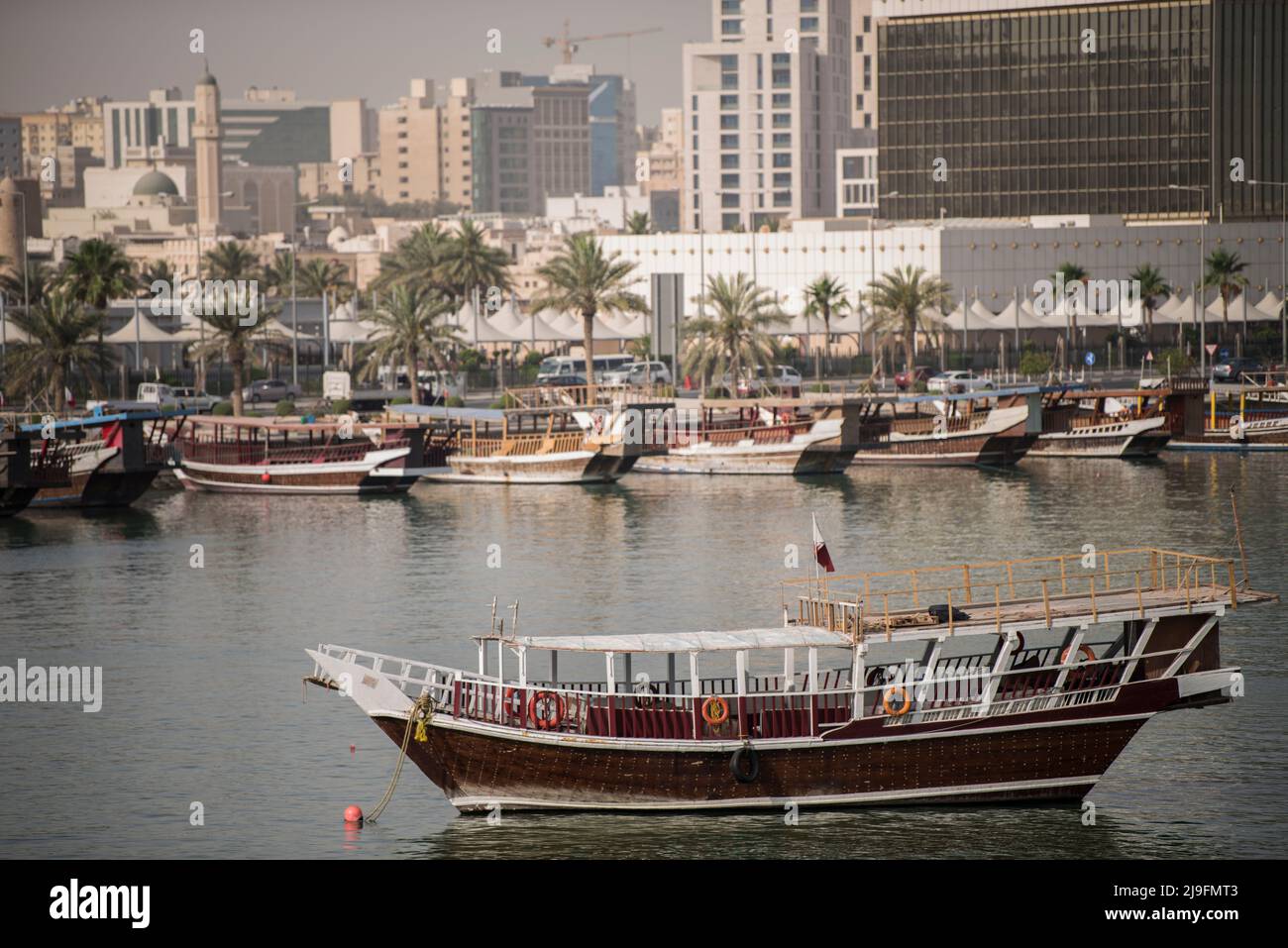 Doha,Qatar- April 24,2022 Traditional boats called Dhows are anchored ...