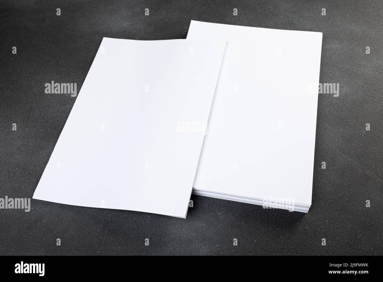 Blank flyer poster a4 or a5 paper isolated on black, place for your ...