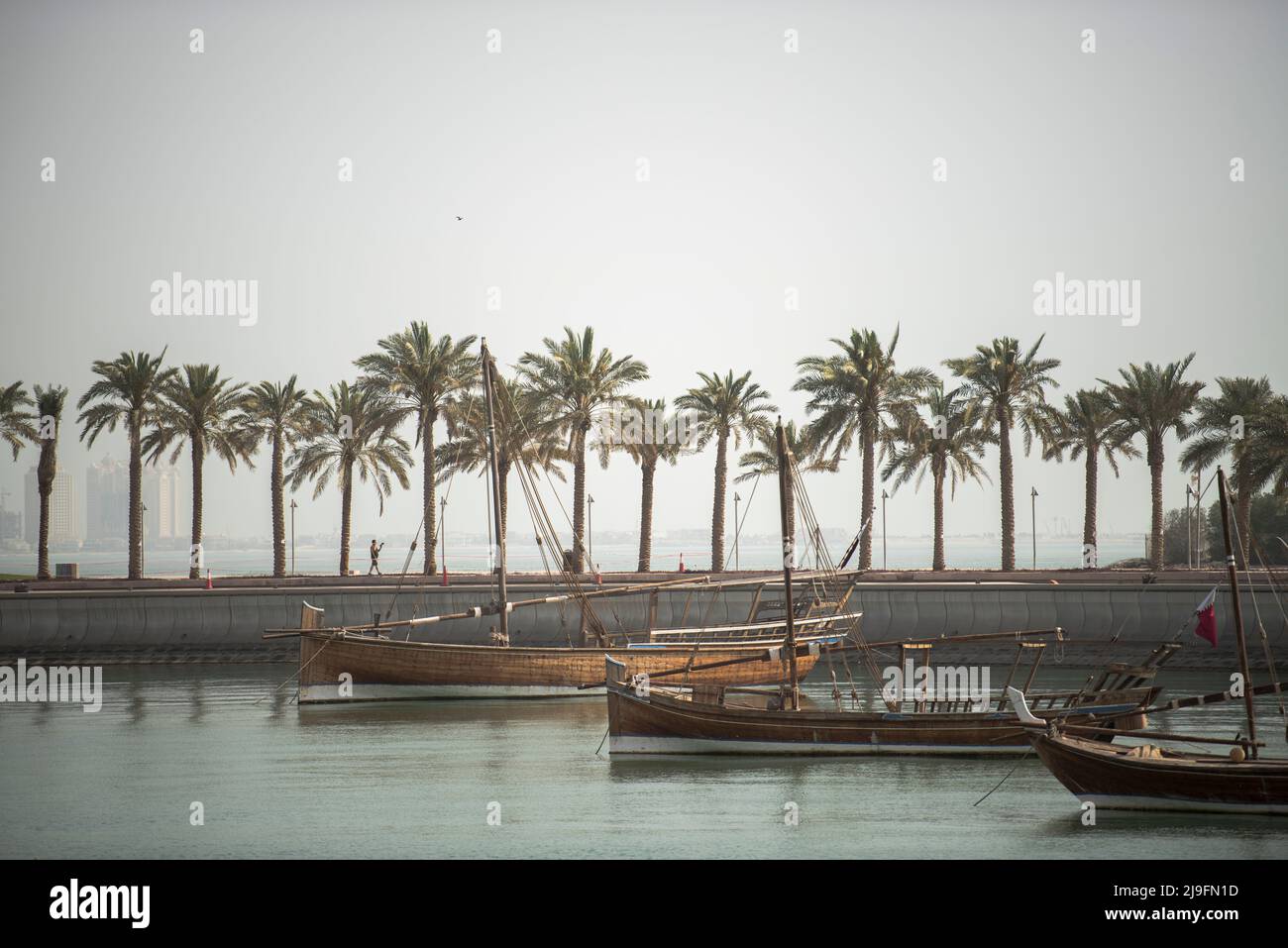 Doha,Qatar- April 24,2022 Traditional boats called Dhows are anchored ...