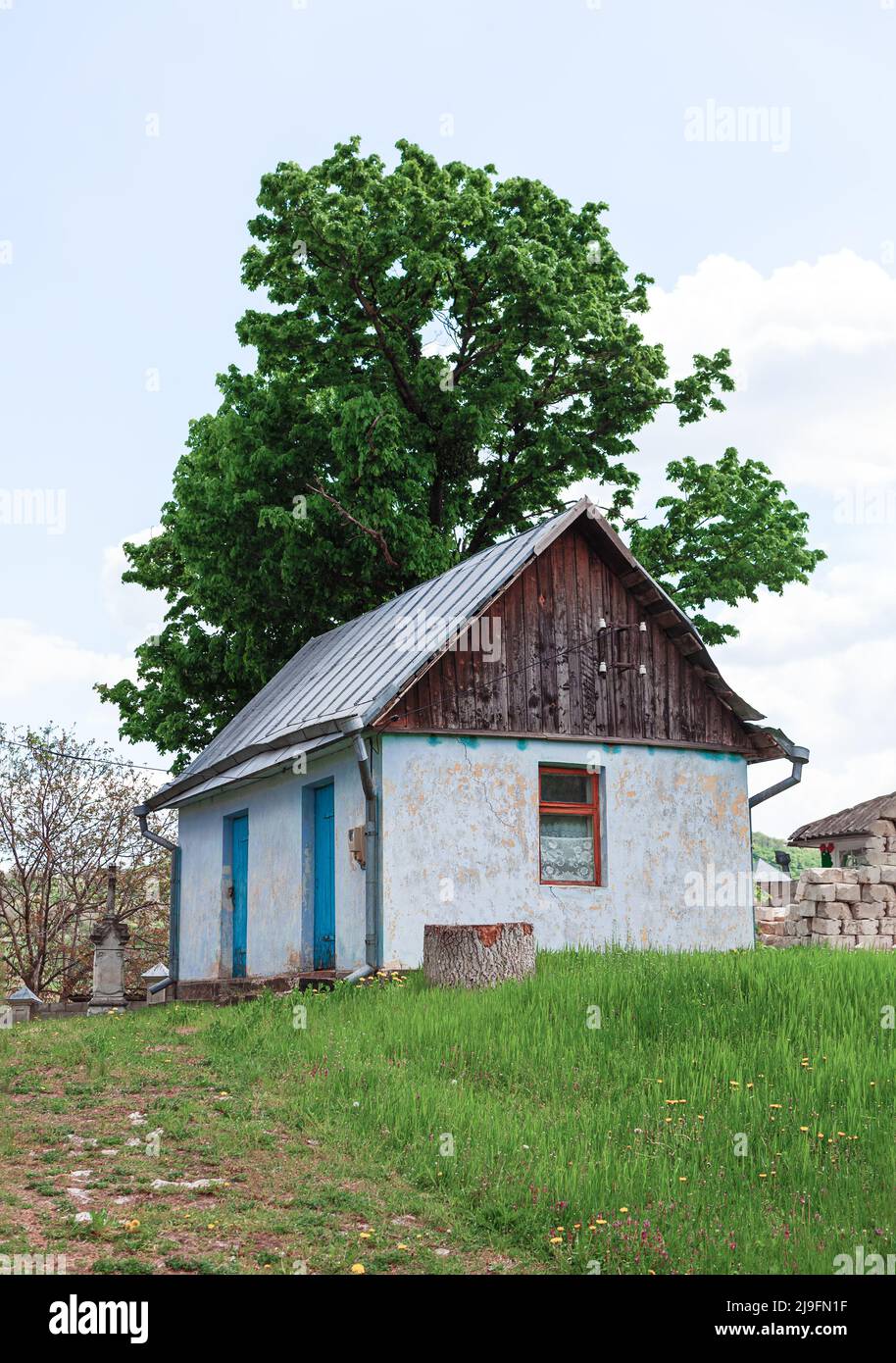 Old barn in the country . Rustic yard with grass overgrown Stock Photo ...