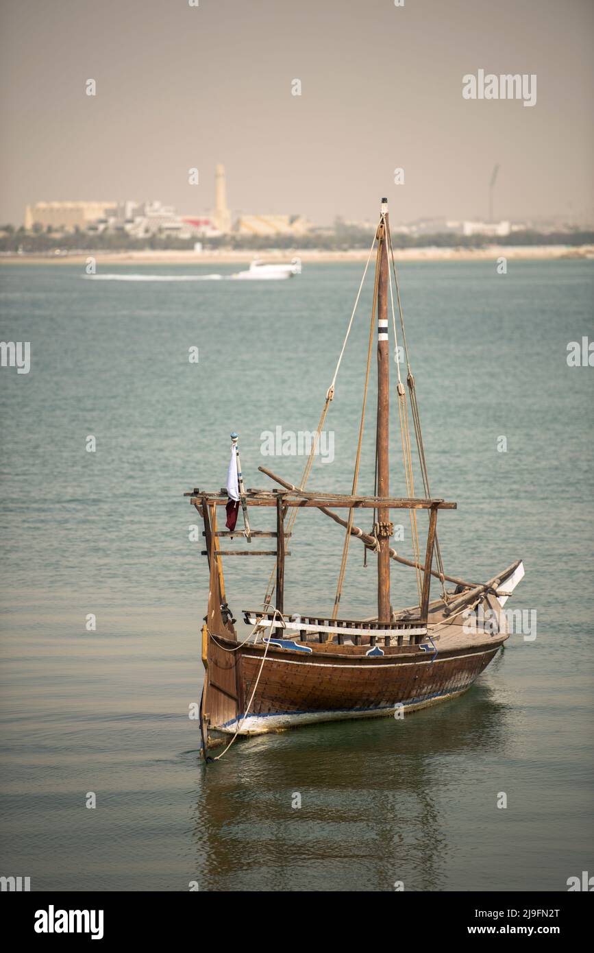 Doha,Qatar- April 24,2022 Traditional boats called Dhows are anchored ...