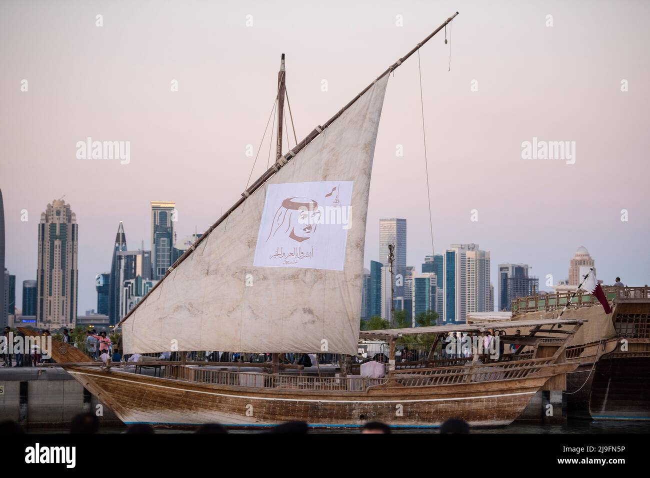 Doha,Qatar- April 24,2022 Traditional boats called Dhows are anchored ...
