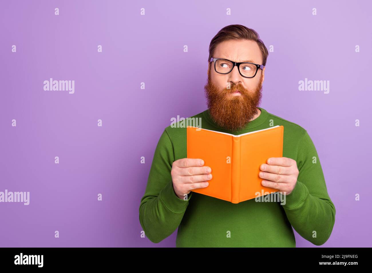 Photo of young smart man looking blank space thinking about book plot ...
