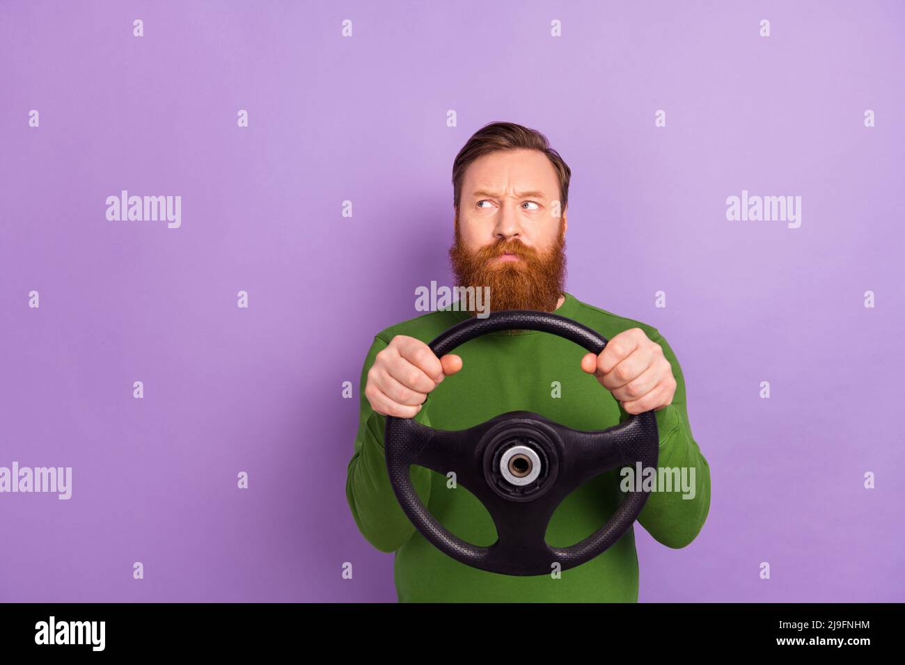 Portrait of serious minded man look empty space brainstorming hold ...