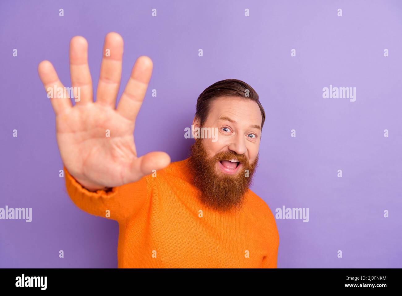 Portrait of overjoyed good mood handsome male meet his friends say ...