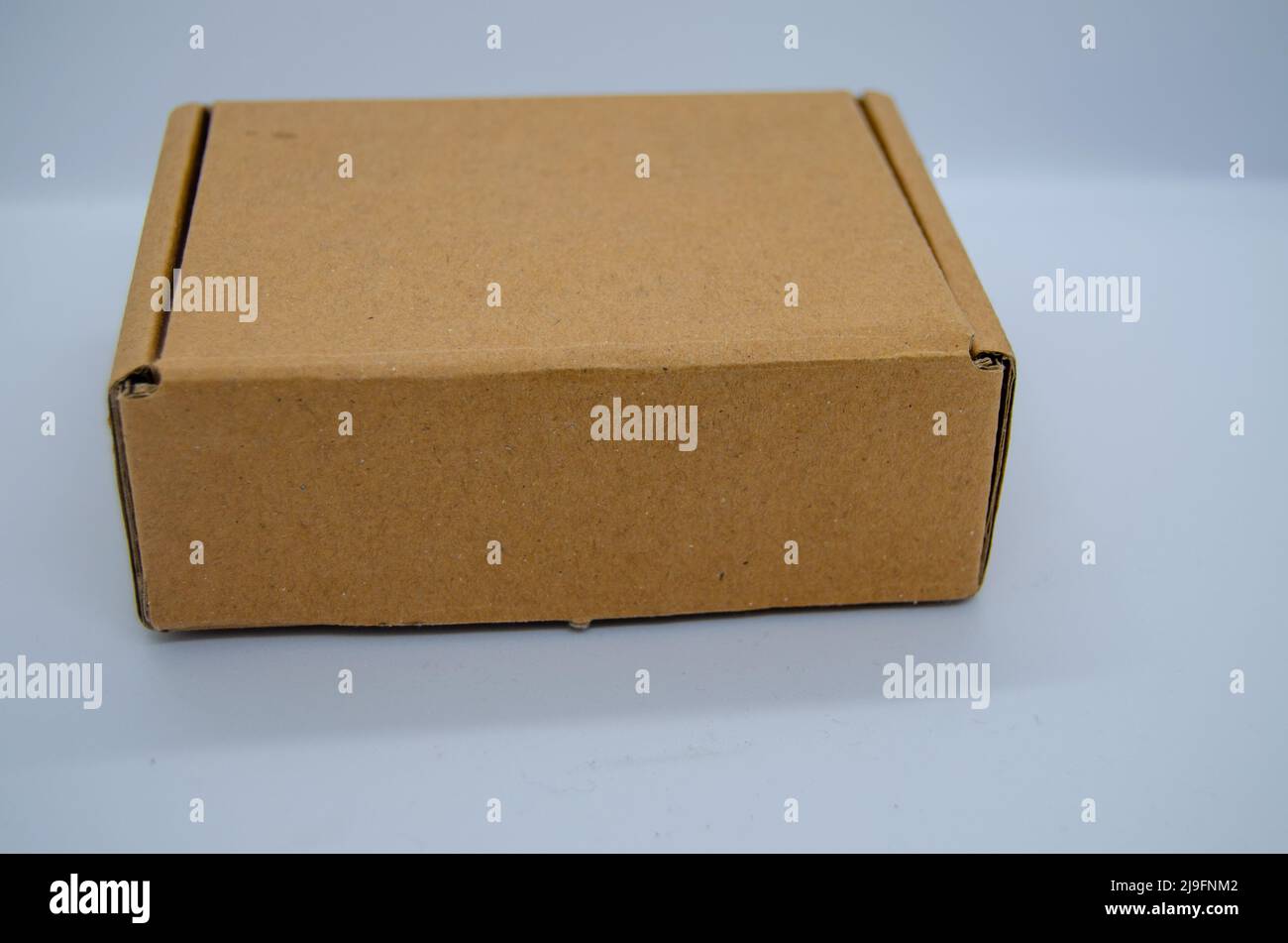 Isolated single blank carton package on white background Stock Photo ...