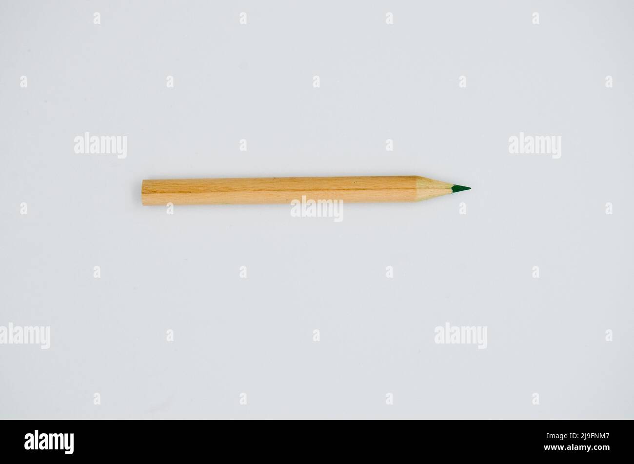 Single isolated small wooden drawing pencil, for student and children ...