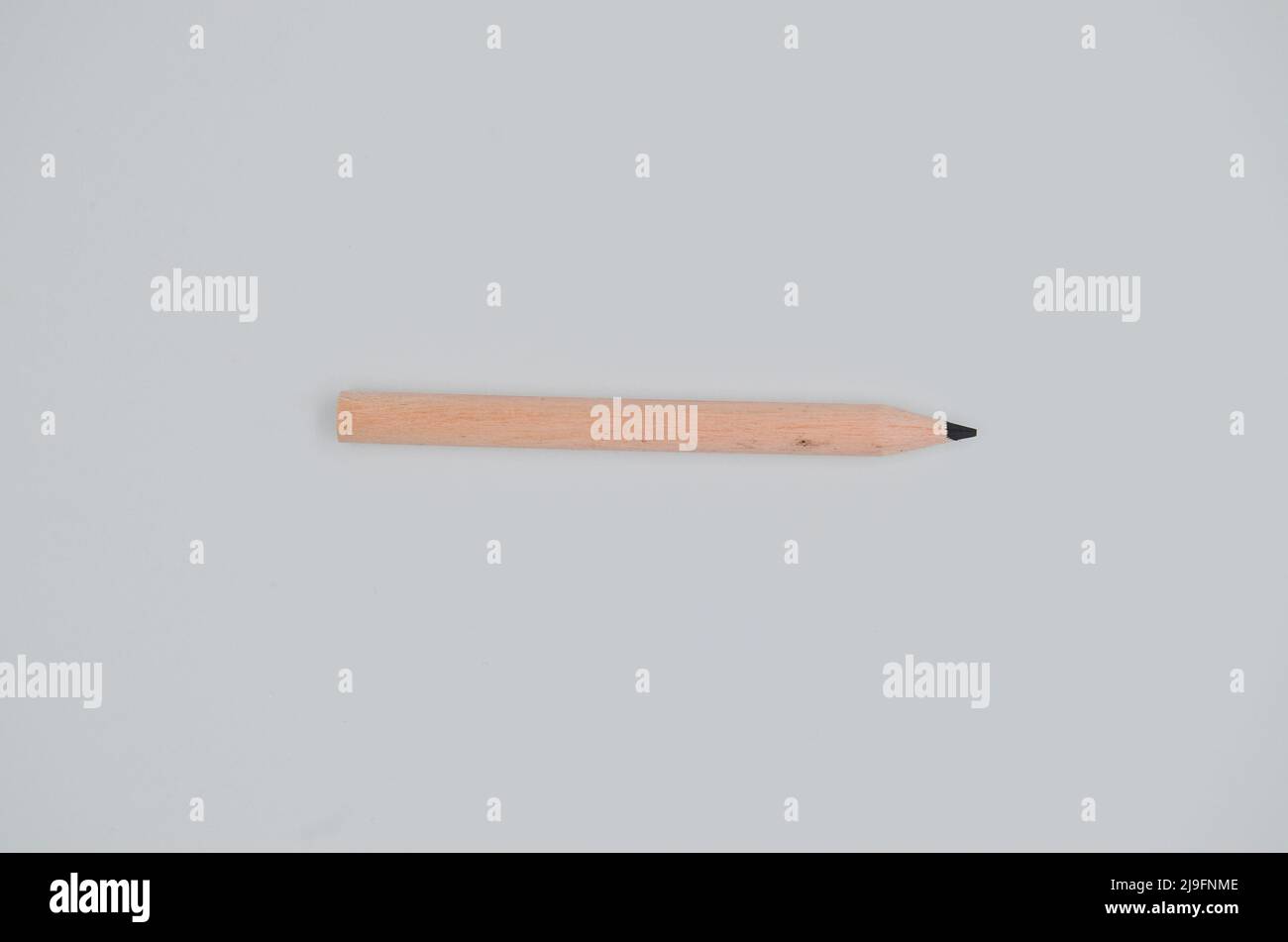 Single isolated small wooden drawing pencil, for student and children ...