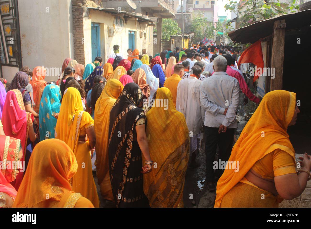 People walking in a busy road in the street market in holy city Pushkar ...