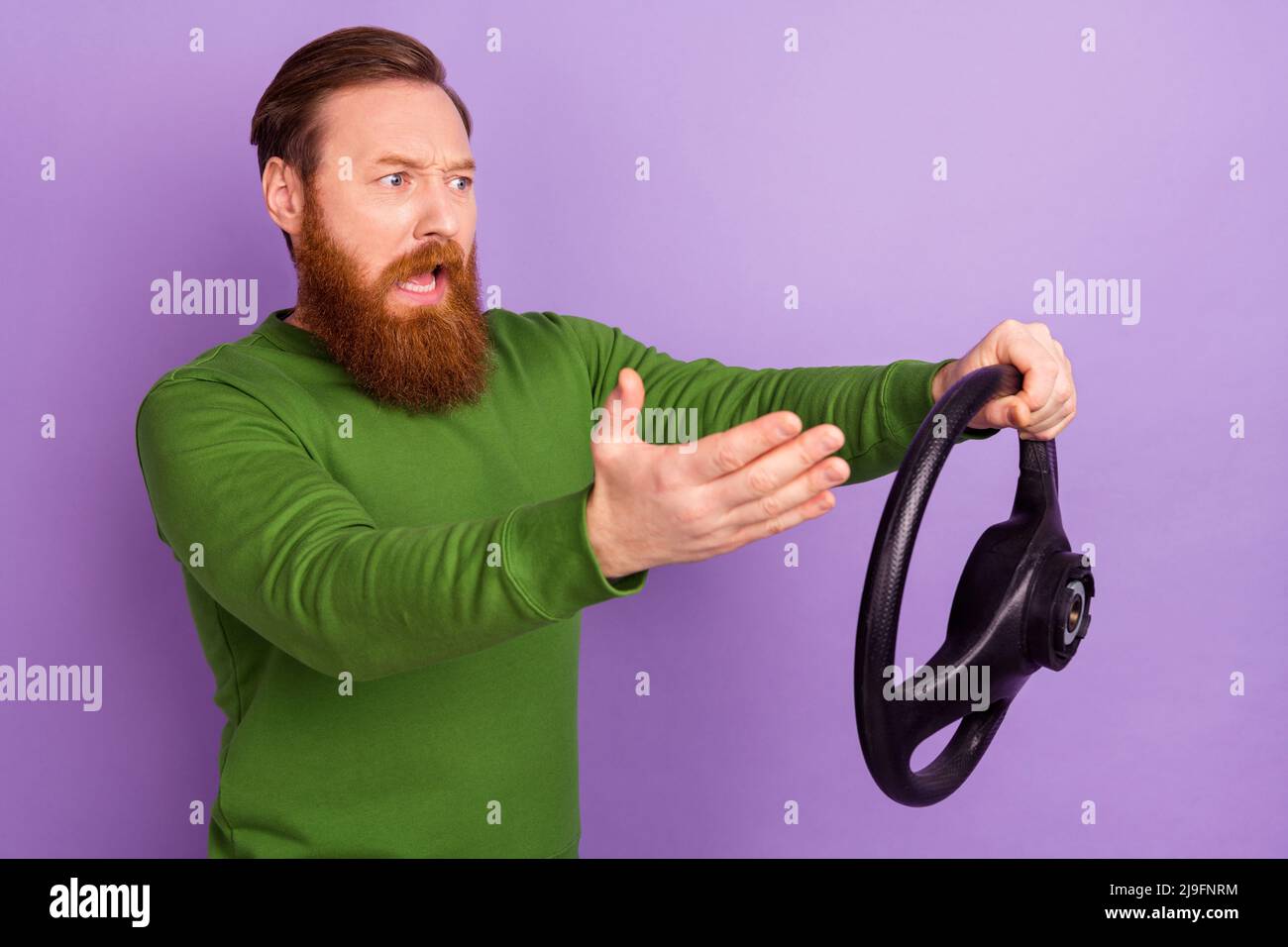 Profile portrait of furious unsatisfied man hold wheel look empty space ...