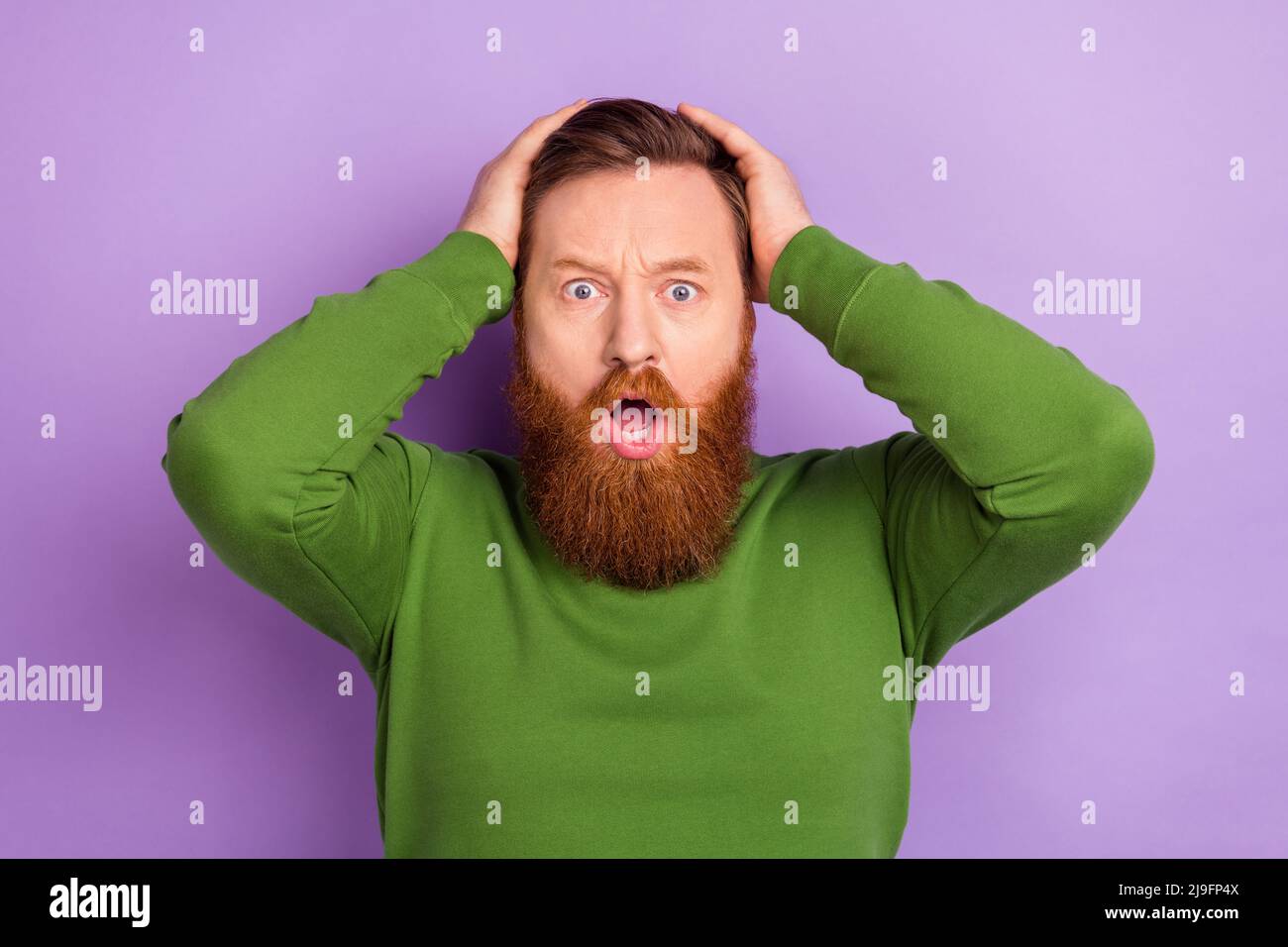 Photo of young scared male screaming oh no touching his head got in ...