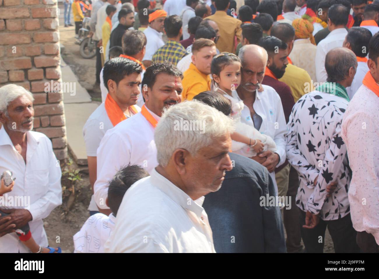 People walking in a busy road in the street market in holy city Pushkar ...