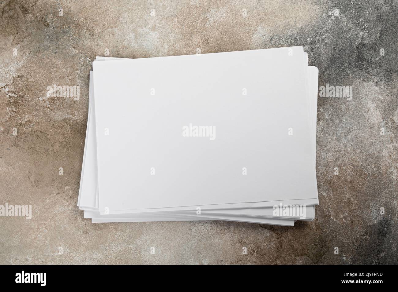 stack of white business card sheet of paper a4 stack on grunge table ...