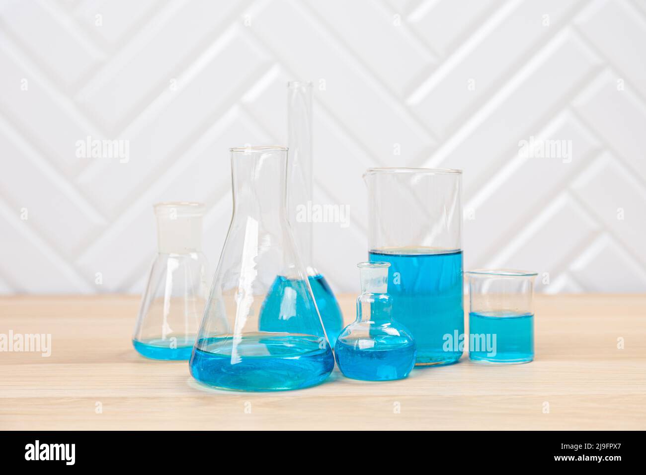 Laboratory glassware with test tubes. flasks, dropper, petri dishes ...