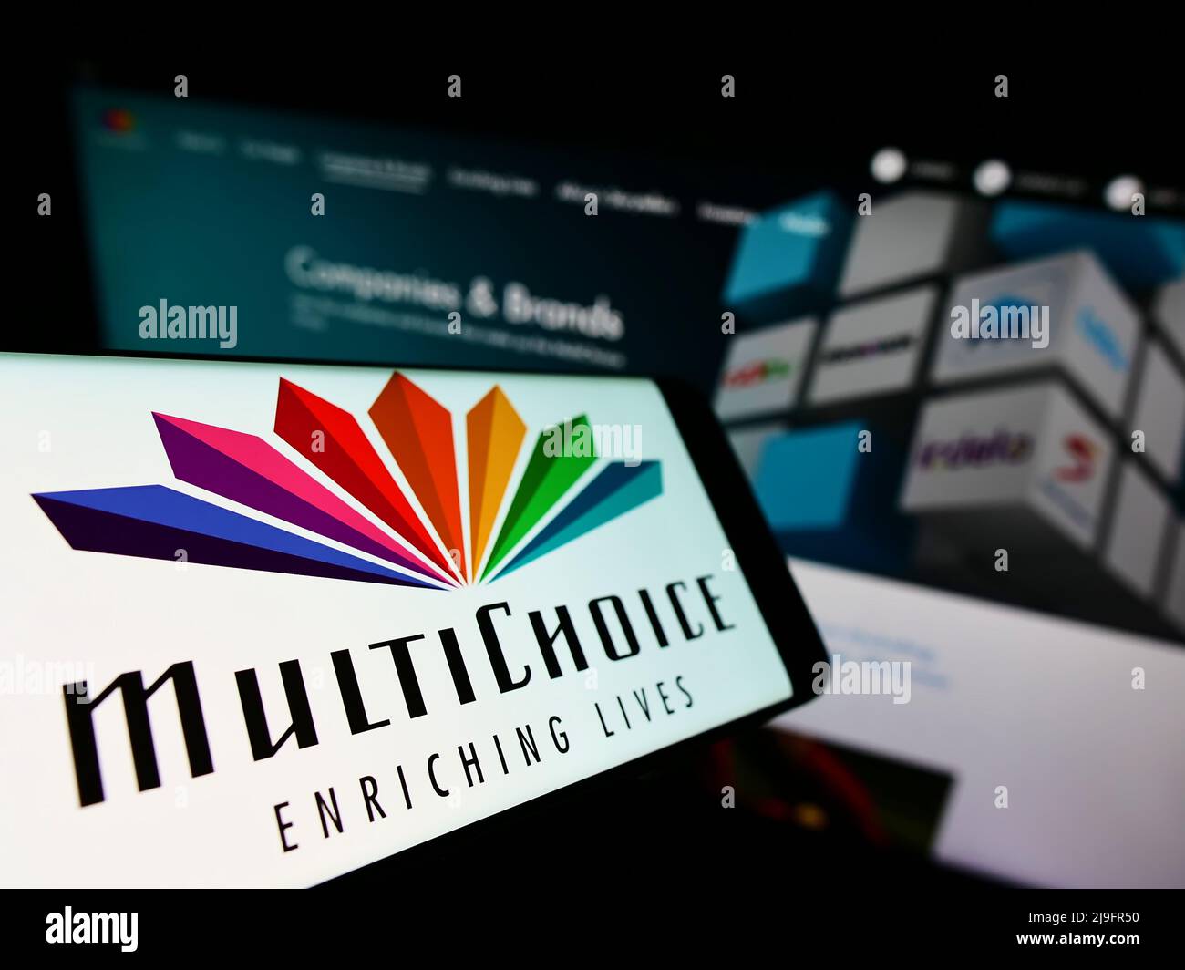 Smartphone with logo of South African media company MultiChoice Group ...
