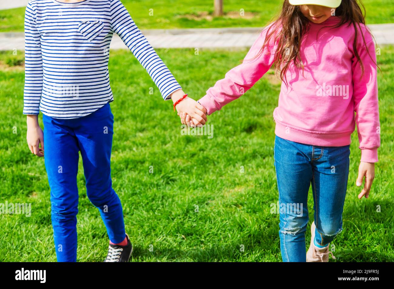 children holding hands in the park.selective focus.kids Stock Photo - Alamy