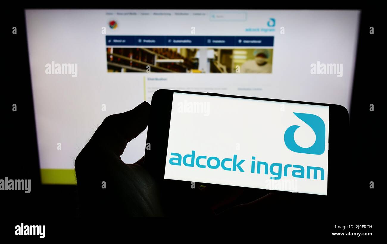 Person holding cellphone with logo of South African pharmaceutical ...