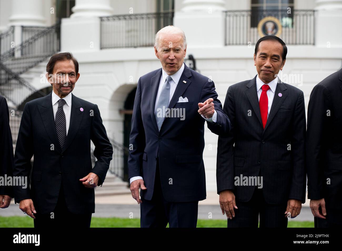 US President Joe Biden (C) stands with Sultan Haji Hassanal Bolkiah (L ...