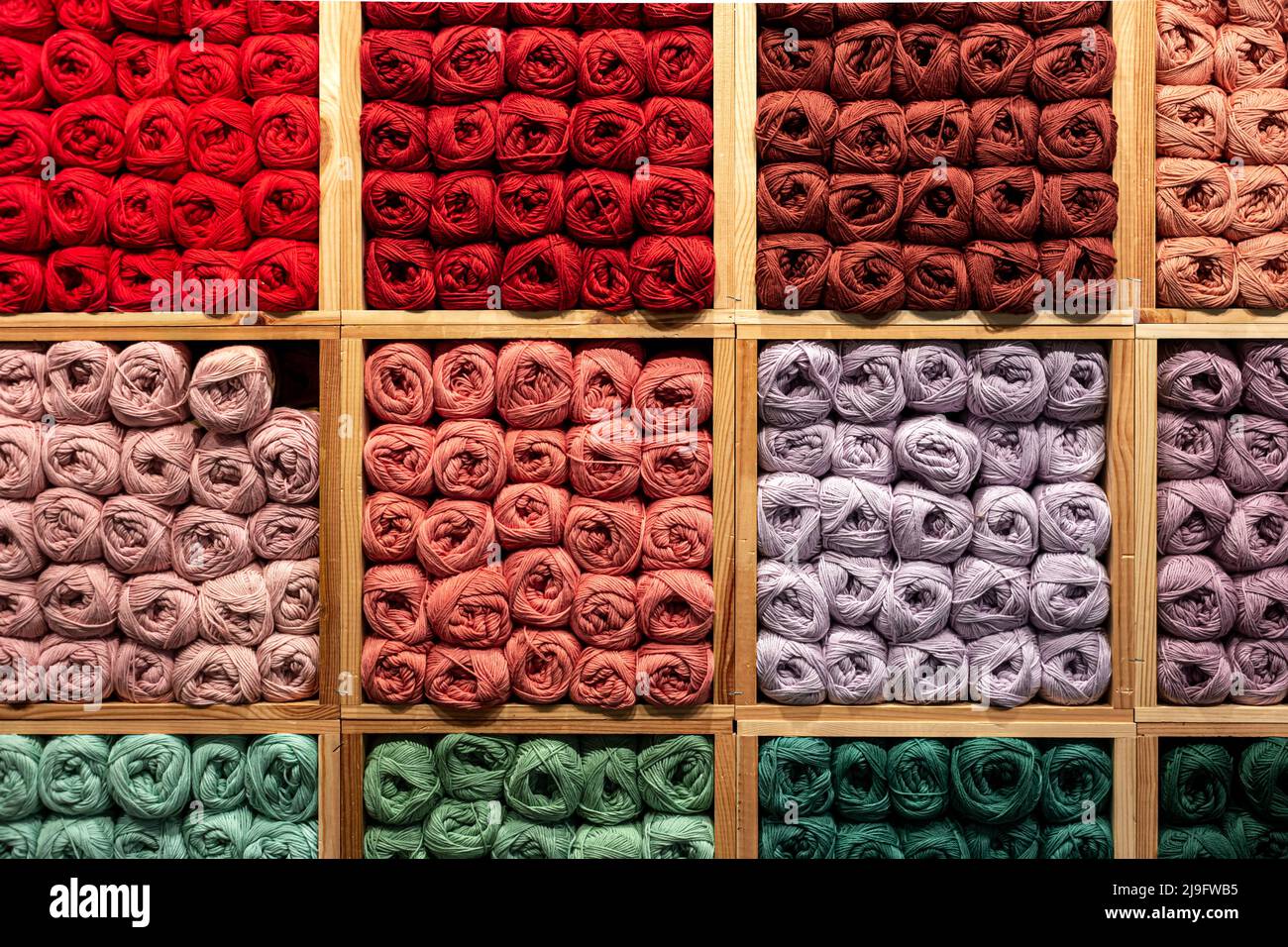 Selection of colorful yarn wool on display in a shop Stock Photo - Alamy