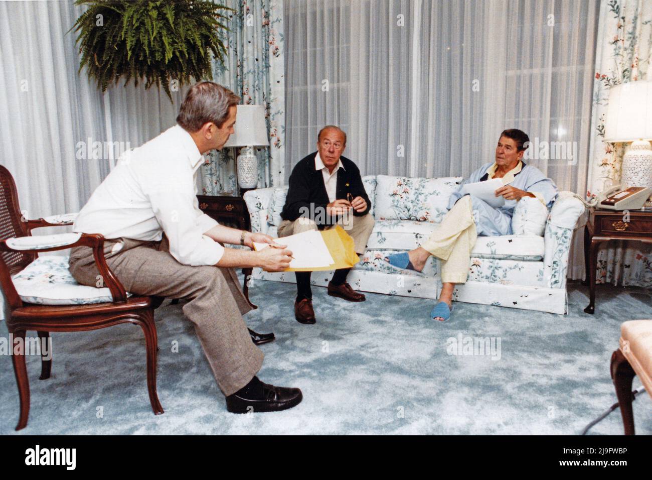 United States President Ronald Reagan, right, is briefed by US ...