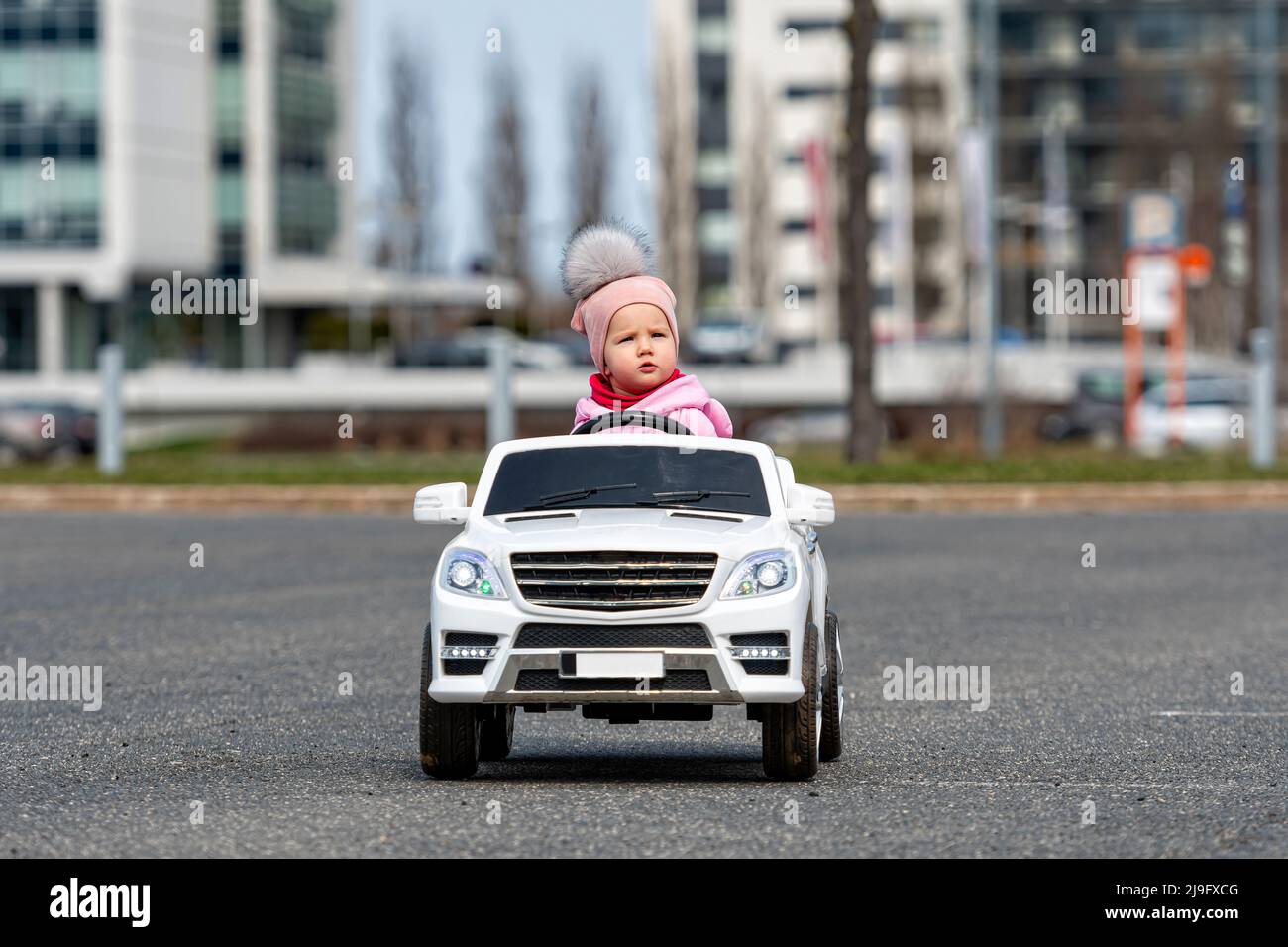 little girldriving a toy car. little driver, childrens car, concept of ...