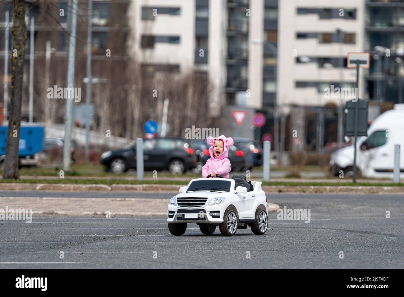 little girldriving a toy car. little driver, childrens car, concept of ...