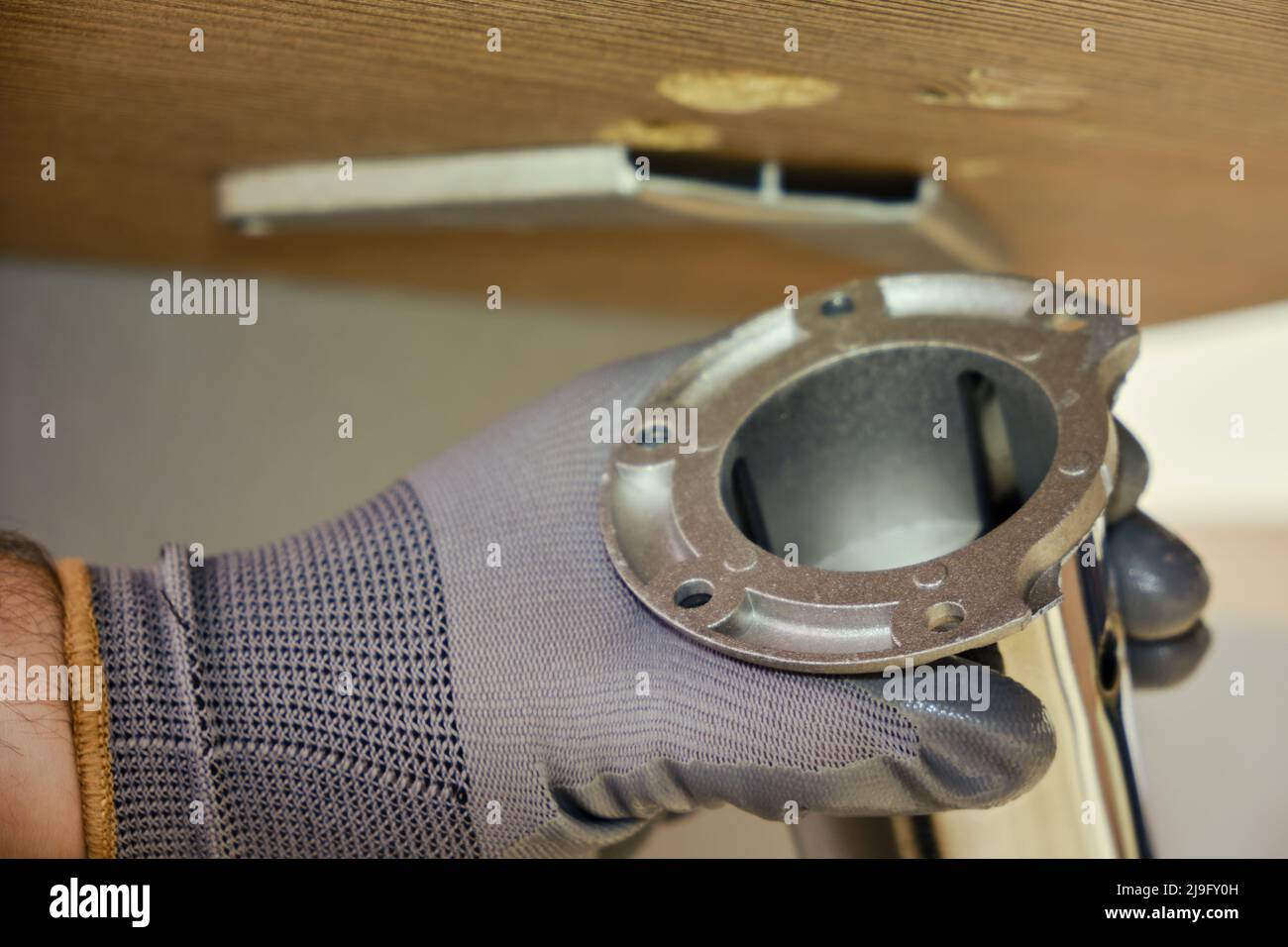 Broken leg of an office desk, repair of furniture made of wood and ...