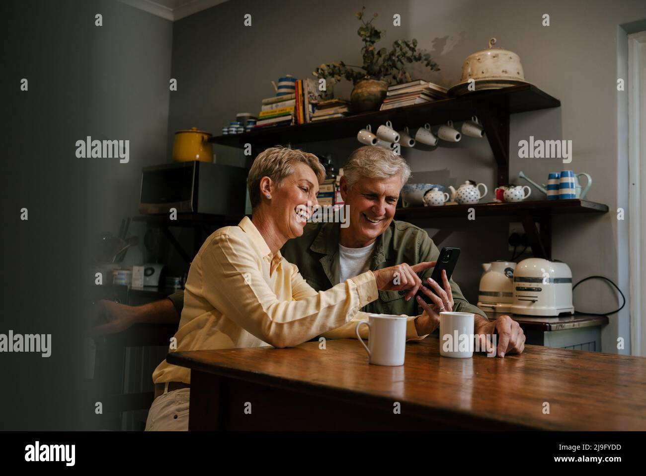 Couple eating drinking in kitchen hi-res stock photography and images ...