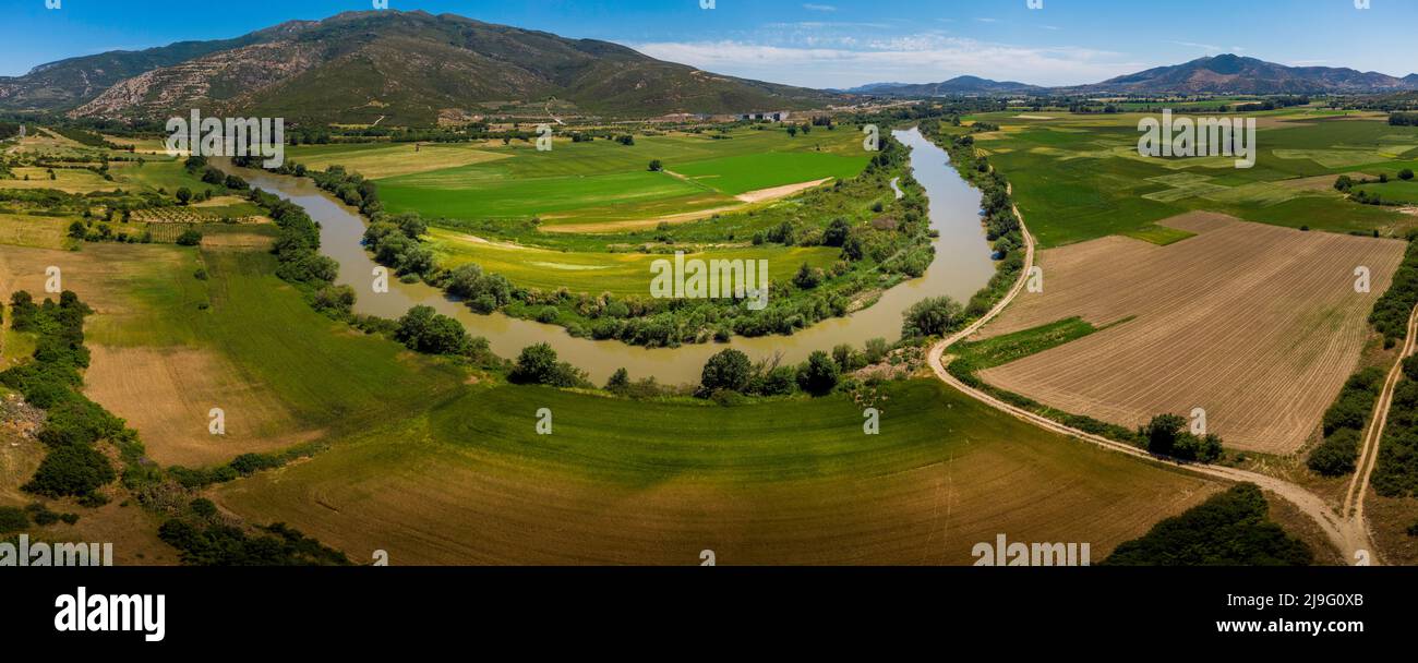 Aerial rural panoramic landscape with Pinios river in the mindle of the ...