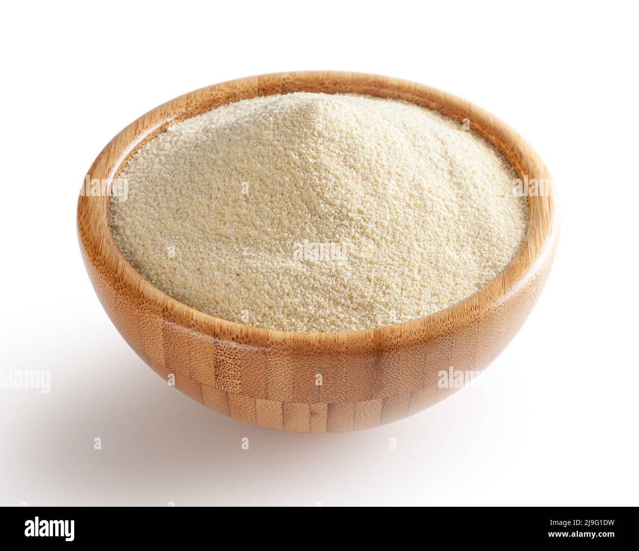 Semolina flour in wooden bowl isolated on white background with ...