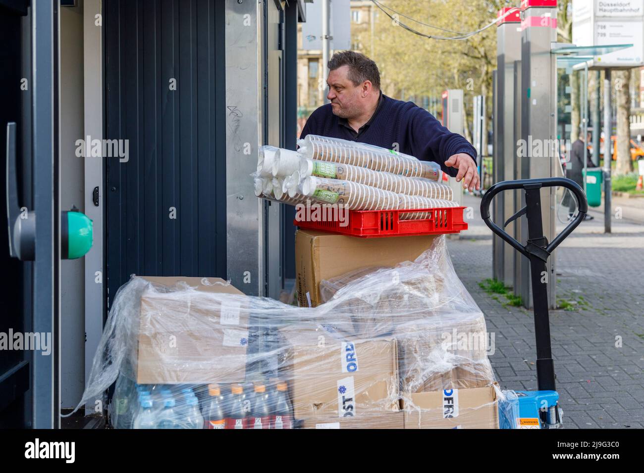 Delivery of groceries at Dusseldorf main station by a forwarding agent ...
