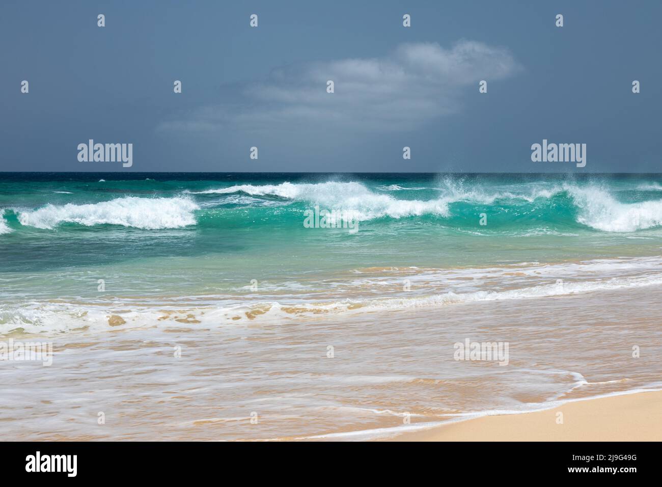 Waves breaking on the white sandy beach of Ponta Preta at Santa Maria ...