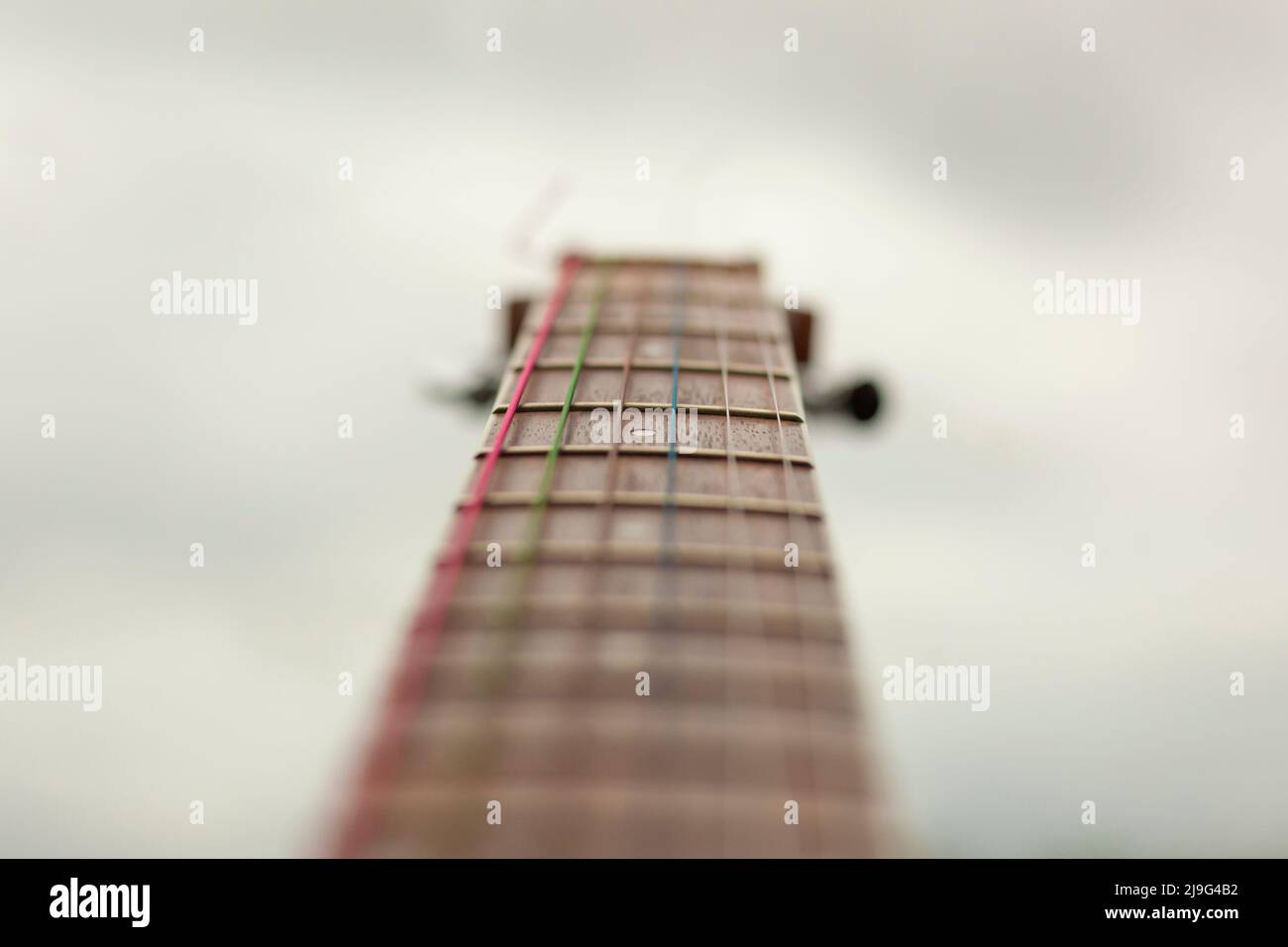 Guitar neck. Acoustic musical instrument. Details of music. Strings are ...