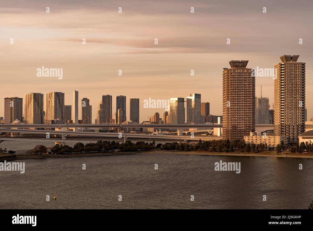 The Rainbow Bridge neighborhood in Tokyo Japan at Sunset Stock Photo ...