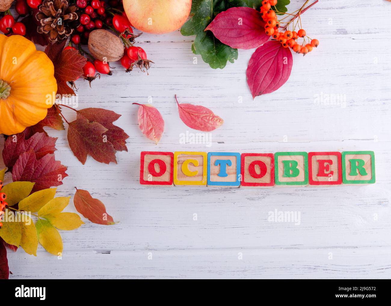 autumn wooden background with leaves, pumpkins with text October Stock ...