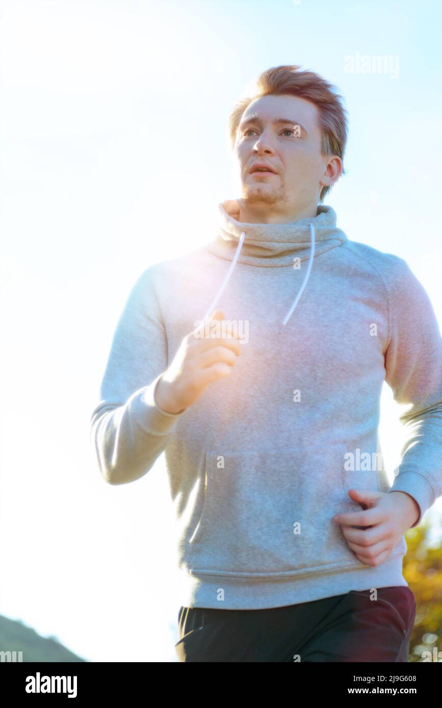 Running man jogging in rural nature at beautiful summer day. Sport ...