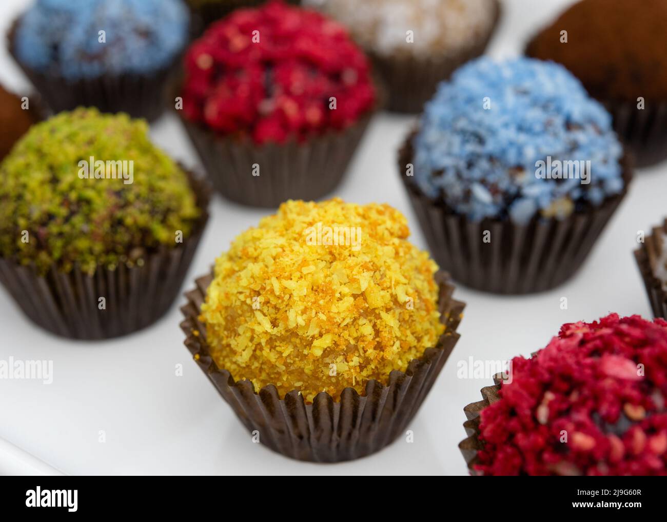 colourful sweet balls with different tastes on white background Stock ...
