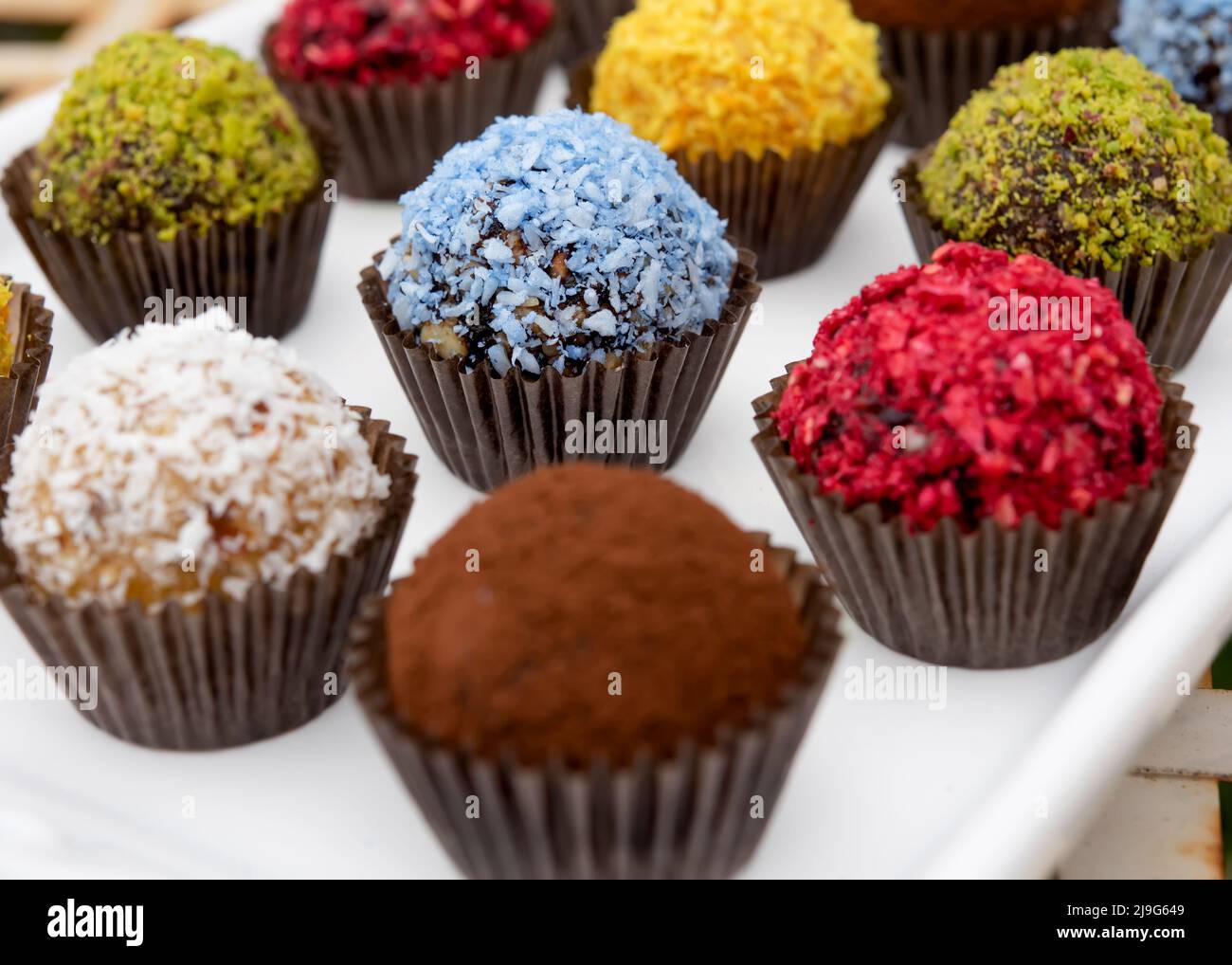 colourful sweet balls with different tastes on white background Stock ...