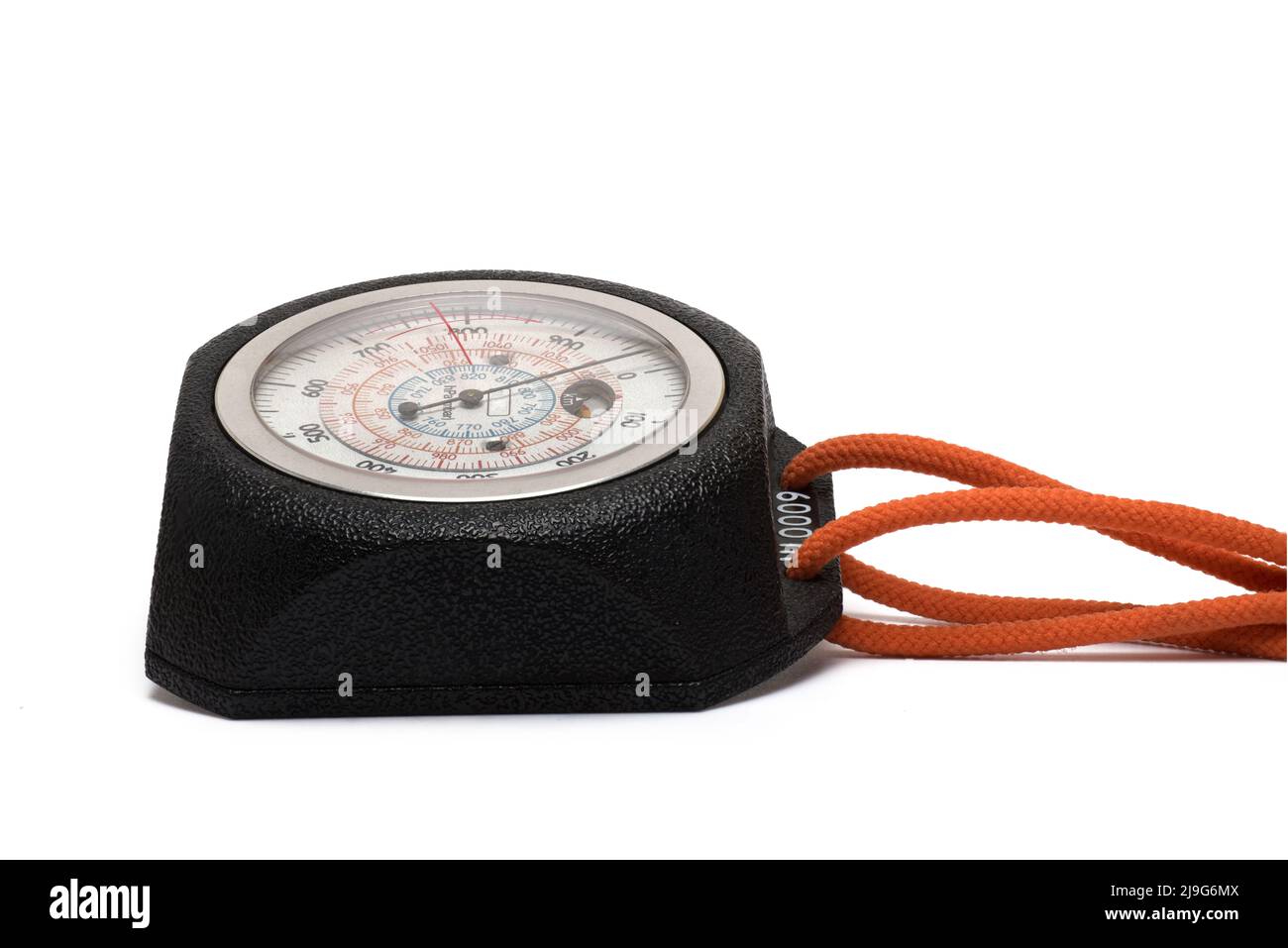Closeup of an old vintage retro black analog altimeter lying on white ...