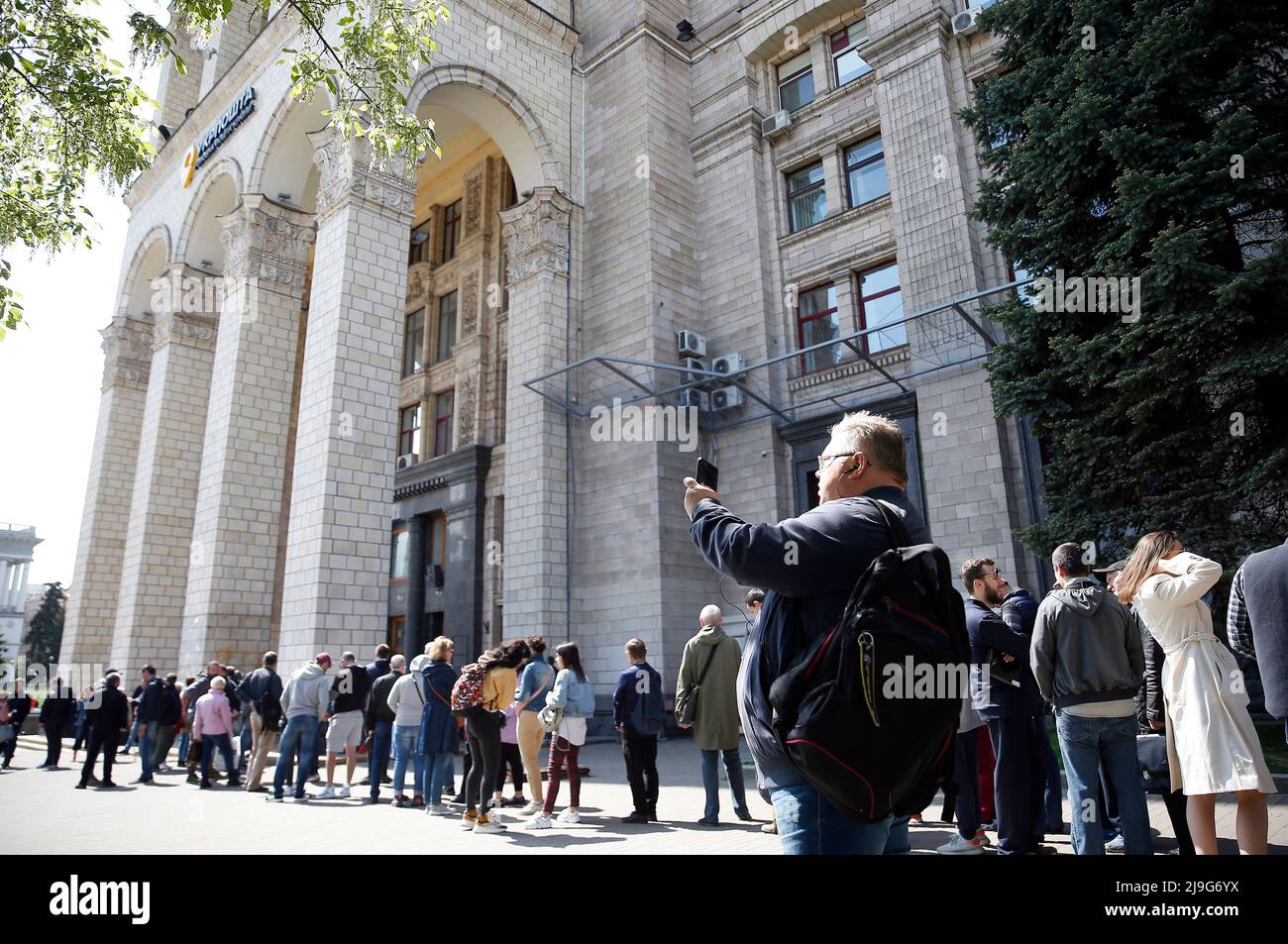 KYIV, UKRAINE - MAY 23, 2022 - People stand in a queue to purchase the ...