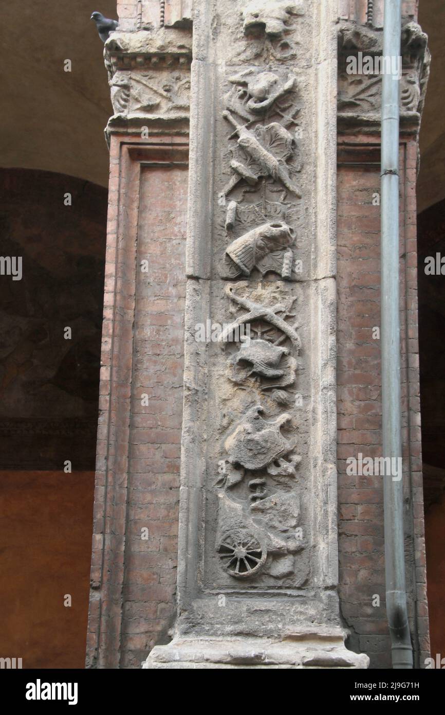Bologna, Italy. Old bas-relief on a portico column, with medieval ...