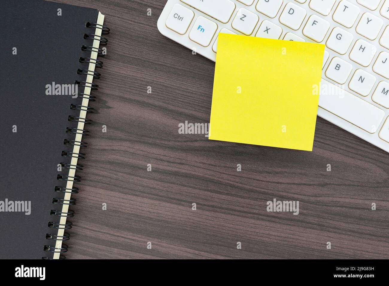 Directly above view of office desk table with computer keyboard ...